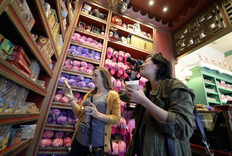Guests look at a display of candy inside the Honeydukes sweets shop in ...